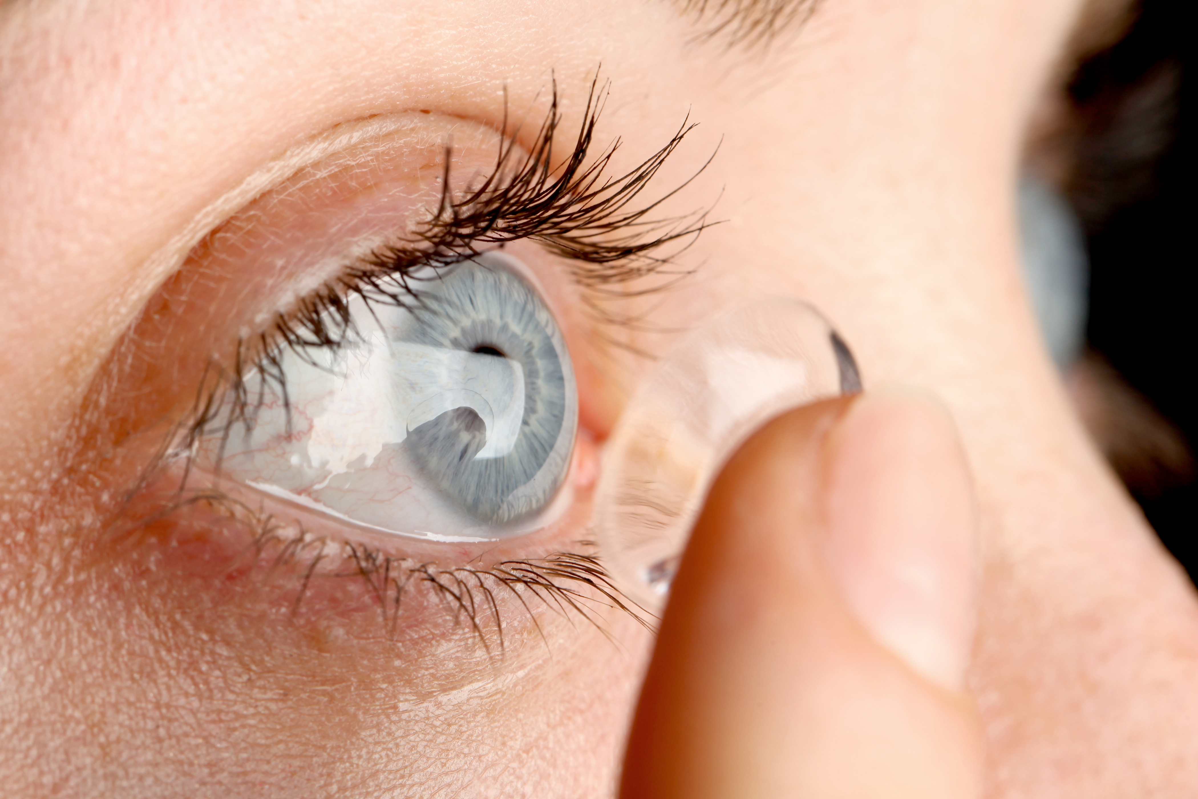 Woman inserting contact lens | Marshall B. Ketchum University